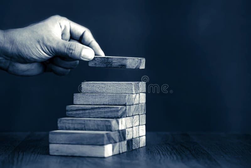 Hand Placing Wooden Block Tower Stack in Pyramid Stair Step with ...