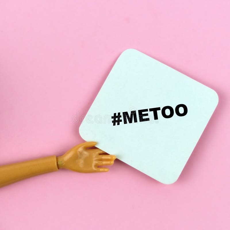 Hand of a Doll with Sign Me Too on a Pink Background Stock Photo ...