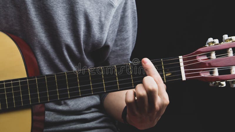 Hand Playing Acoustic Guitar. String Instrument Close Up Stock Photo ...