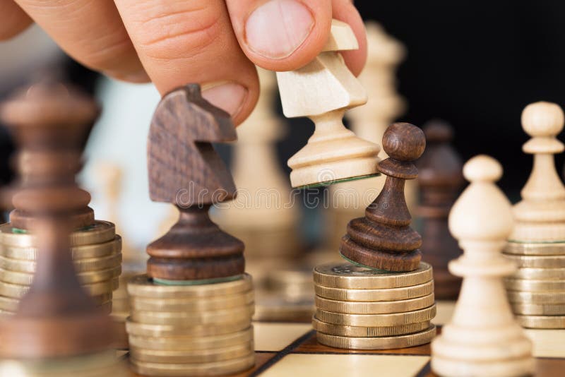 Hand Playing Chess Stacked on Coins Stock Image - Image of money ...