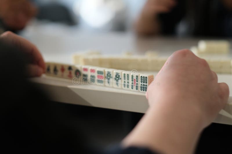 Hand Playing Chinese Mahjong Game Stock Photo - Image of mahjong, blur ...