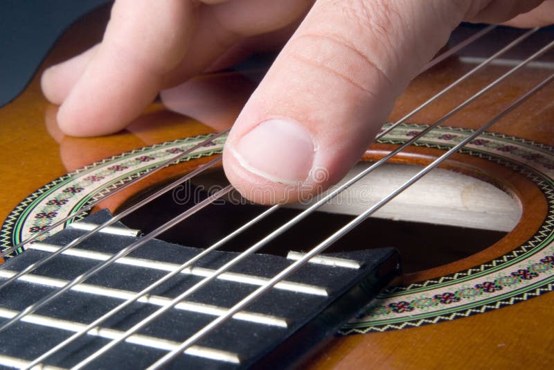 Hand Strumming Guitar Strings Stock Image - Image of tune, black: 12090559