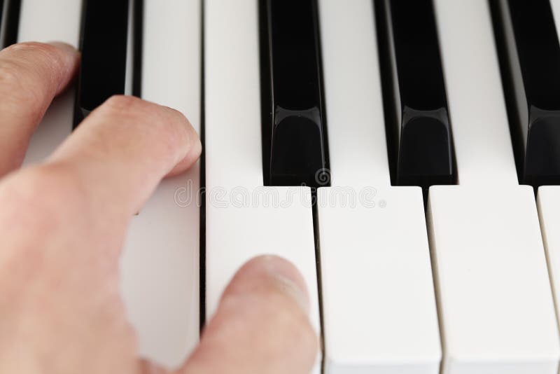 Hand playing piano stock image. Image of music, closeup - 31165149
