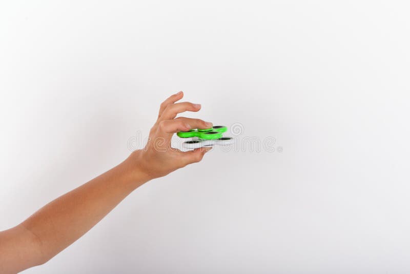 Hand Playing with Two Fidget Spinners Stock Image - Image of spin, game ...