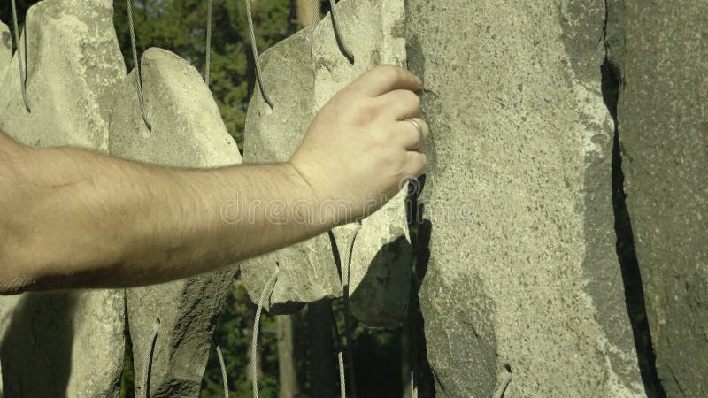Hand Plays on Sounding Stones. Shorted Stones Hung on String Like ...