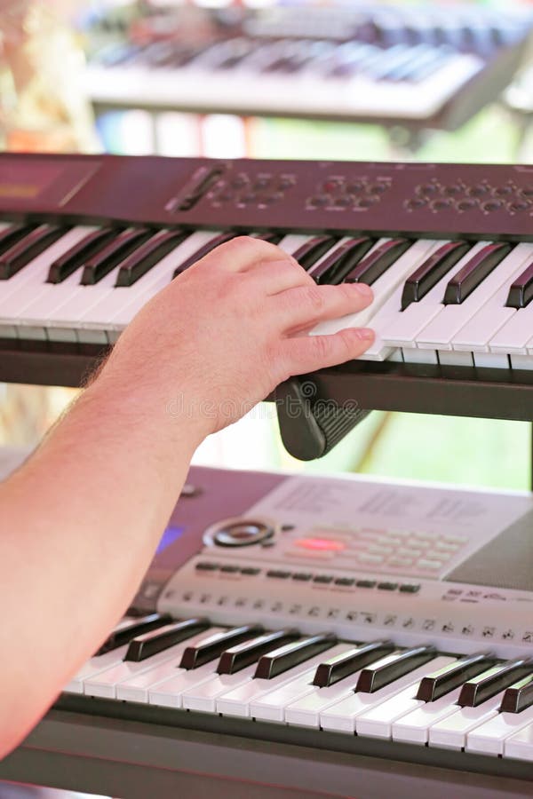 The Hand Plays a Synthesizer Stock Photo - Image of skill, artist: 10615758