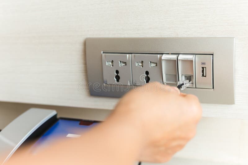 Hand Plug in Internet Cable Wire into Extender Device Socket on the ...
