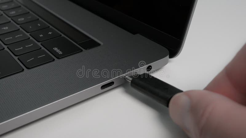 A USB Type C / USB-C Cable Being Plugged into a Modern Notebook ...