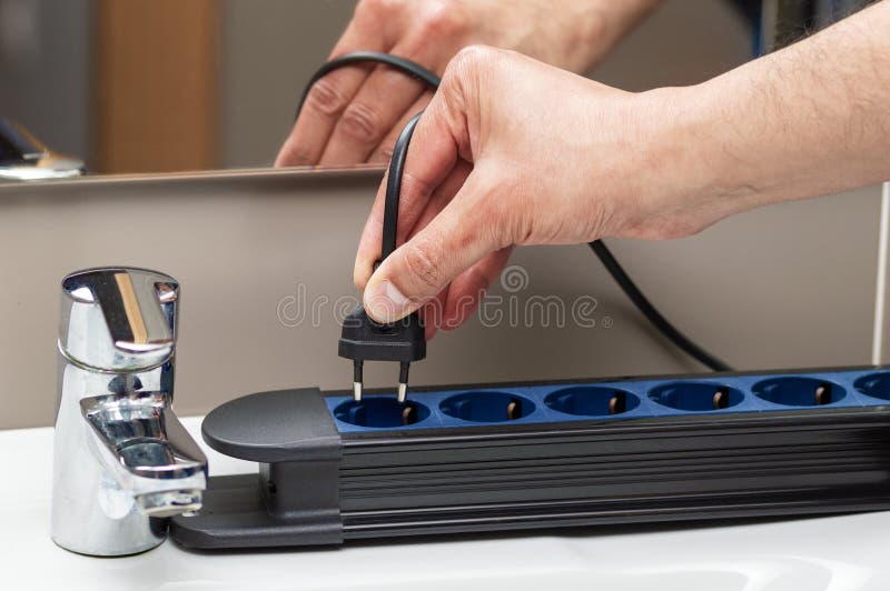 Hand Plugging Electric Plug Stock Photo - Image of person, handling ...
