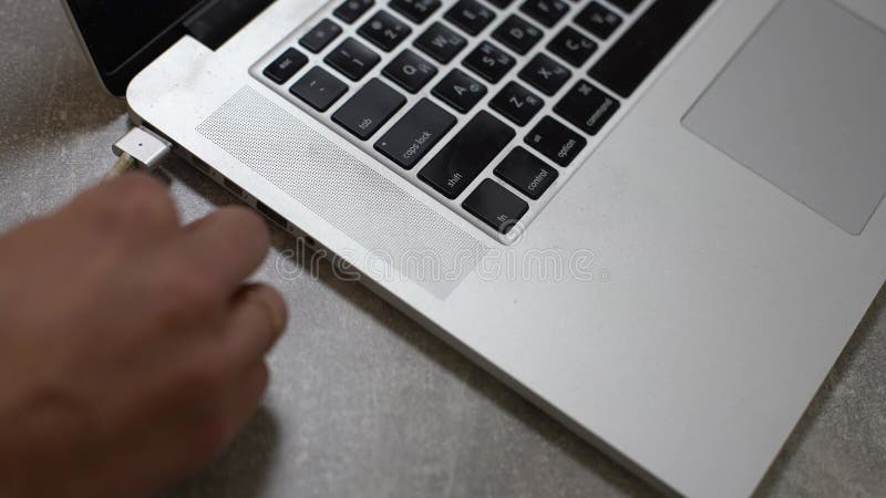 Hand Plugging Power Adapter in Laptop, Everyday Computer Technology ...
