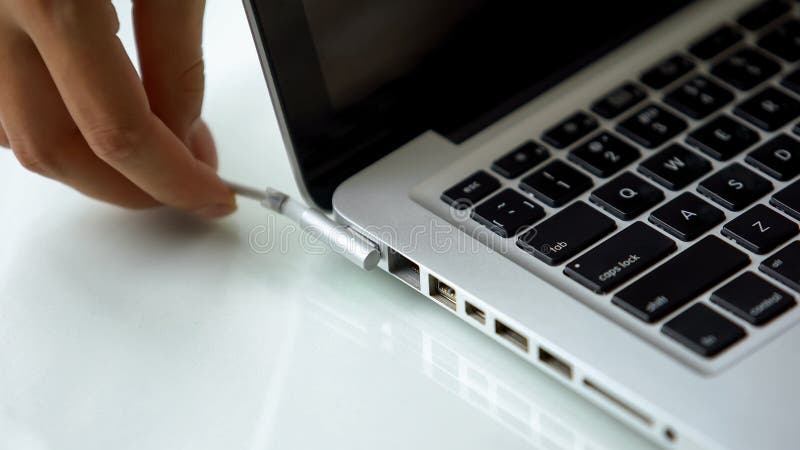 Hand Plugging Power Adapter in Laptop, Everyday Computer Technology ...