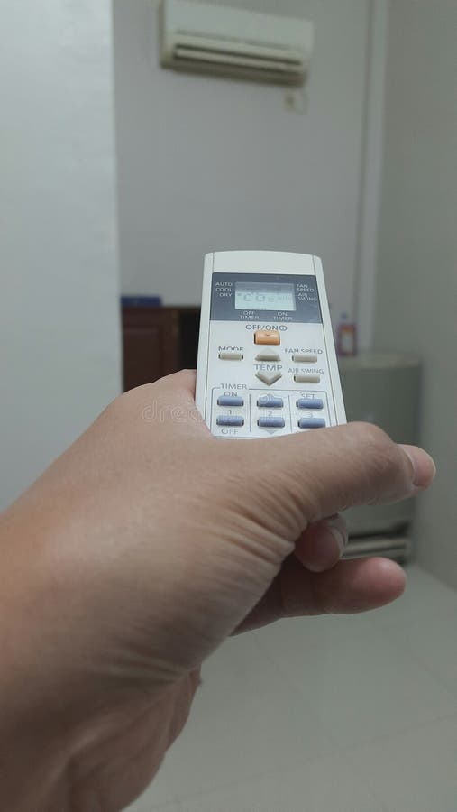 Hand Pointing a Ac Remote Control Towards the Ac Stock Photo - Image of ...