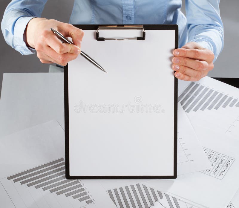 Hand Pointing at Blank Paper in Clipboard with a Pen Stock Photo ...