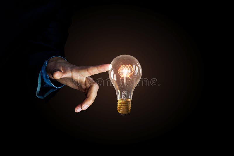 Hand pointing light bulb stock image. Image of assist - 94126901
