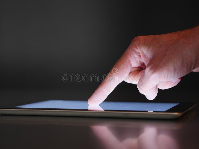 A Hand Pointing at a Tablet Screen Stock Photo - Image of black ...