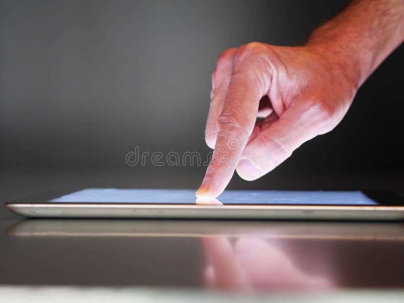 A Hand is Pointing at a Tablet Screen Stock Image - Image of anfassen ...
