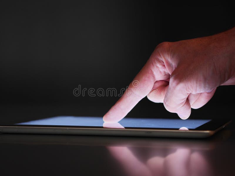A Hand Pointing at a Tablet Screen. Stockphoto. Stock Image - Image of ...