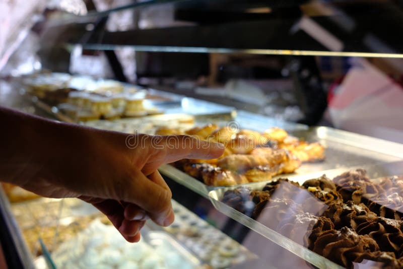 A hand pointing to food stock photo. Image of choices - 169916602