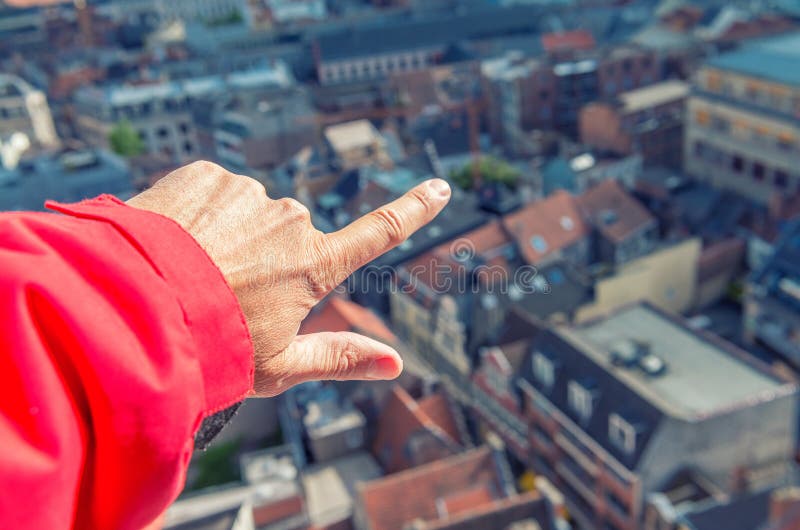 Hand Pointing Towards City Buildings Stock Photo - Image of finger ...