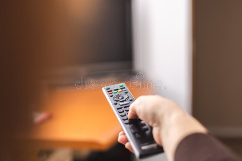 Hand Pointing a Tv Remote Control Towards the Television Stock Photo ...