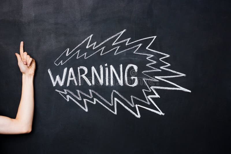 Hand Pointing Up Near Warning Drawn on Blackboard Stock Photo - Image ...