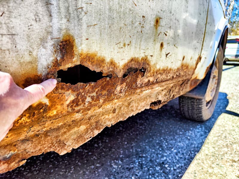 A Hand Points at Rust Damage on a Cars Body Panel Stock Photo - Image ...