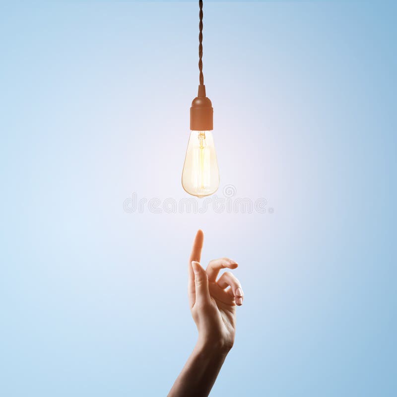 Hand points to light bulb stock image. Image of imagination - 68042029