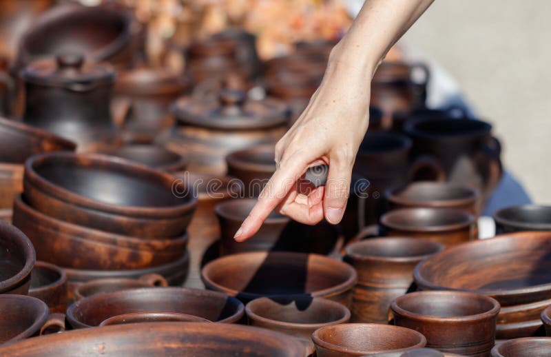 A Hand Points To a Pot on a Table Stock Photo - Image of work, natural ...