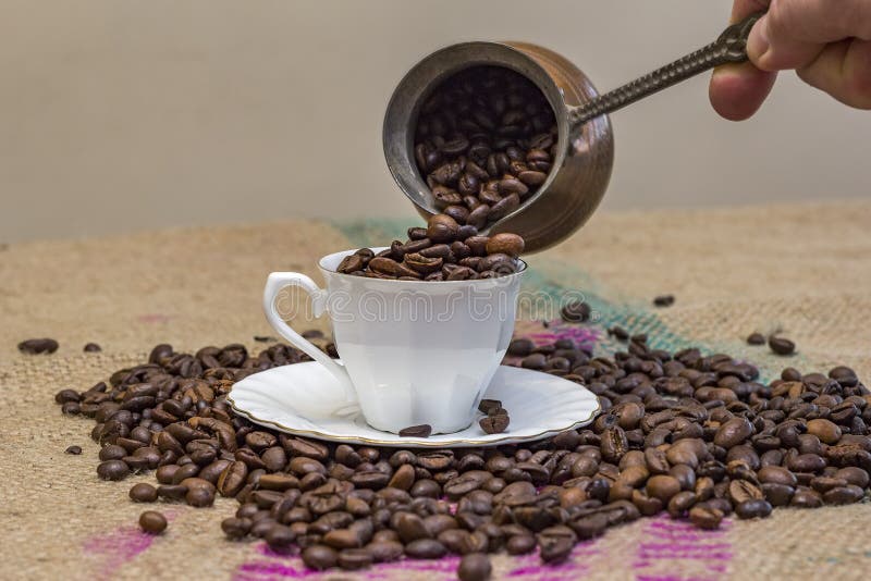 Hand pouring coffee beans stock image. Image of caffeine - 82575485