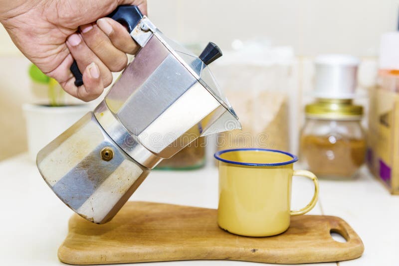 Hand Pouring the Coffee from Styrofoam Cup To the Mug Cup Stock Photo ...