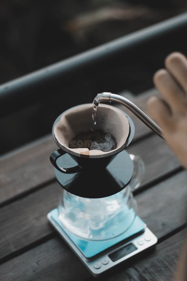 A Hand Pouring Hot Water into V60 Coffee Stock Photo - Image of glass ...