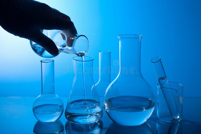 Hand Pouring Liquid into Flask Stock Image - Image of medical ...