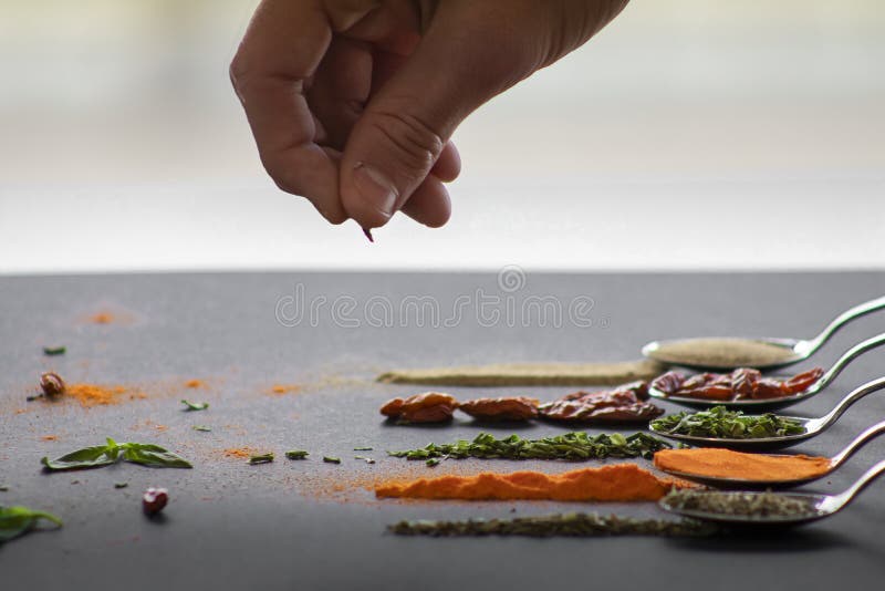 Hand pouring spices stock image. Image of food, kitchen - 236069919