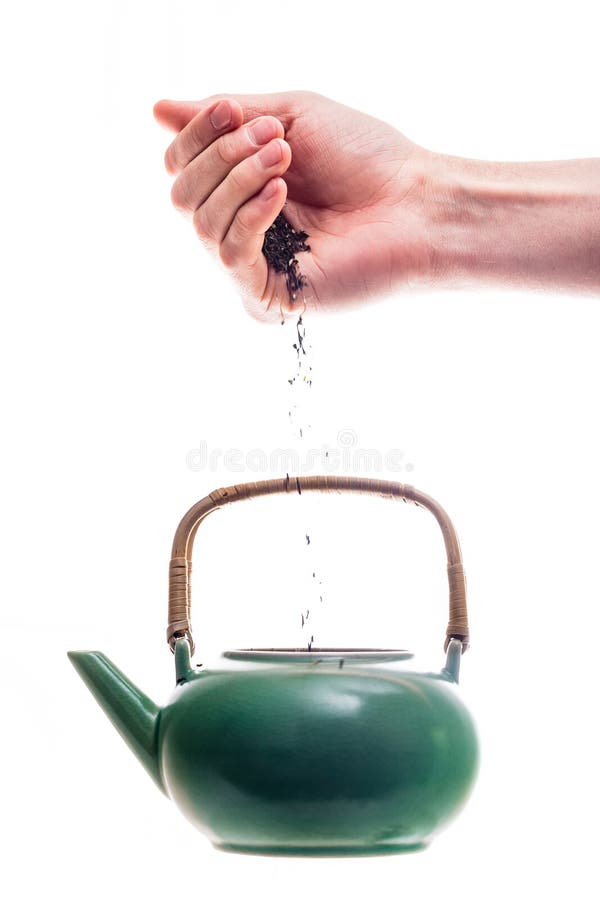 Hand Pouring Tea Leaves into the Ceramic Teapot Stock Photo - Image of ...