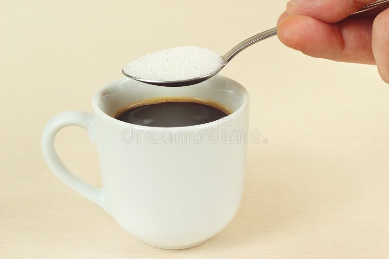Hand Pours Sugar from Spoon in a Coffee Cup Stock Image - Image of ...