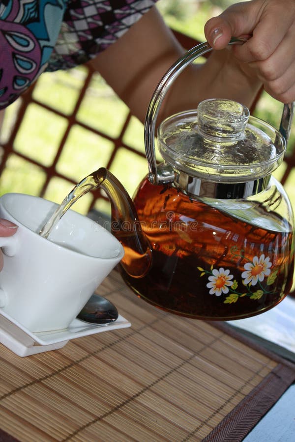 The Hand Pours Teapot in Cup Tea Stock Image - Image of metal, napkin ...