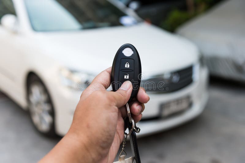 A Hand Press Button of Remote Control Car Key To Open a Car Door Stock ...