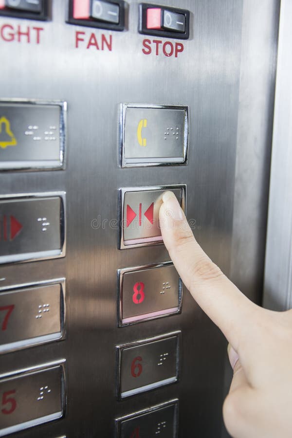 Hand Press Open Door Button in Elevator Stock Photo - Image of building ...