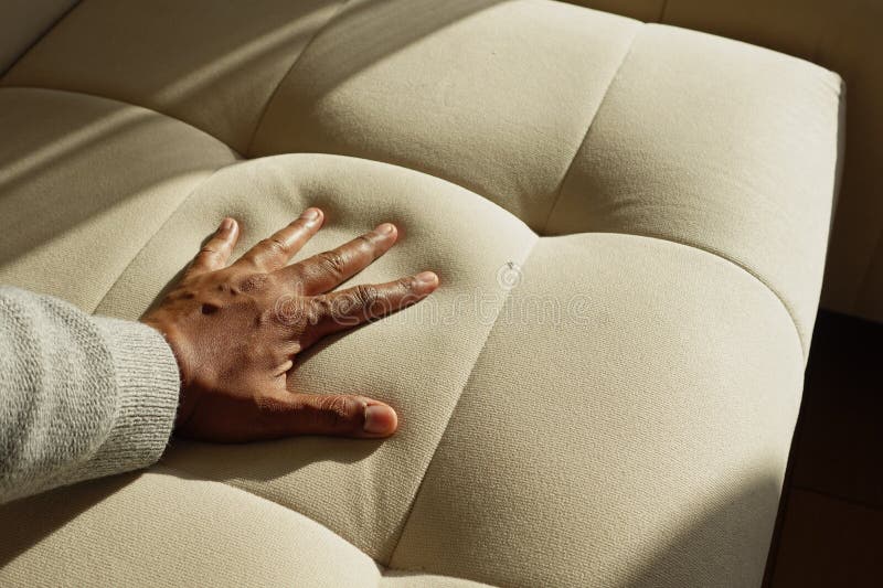 Hand Resting on Soft Fabric Surface in Cozy Interior Setting Stock ...