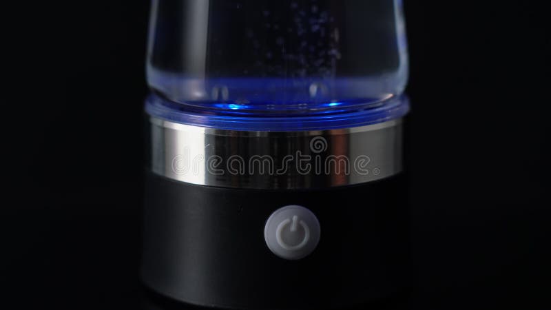 The Hand Presses a Button in the Ionization Device, Bubbles Rise ...