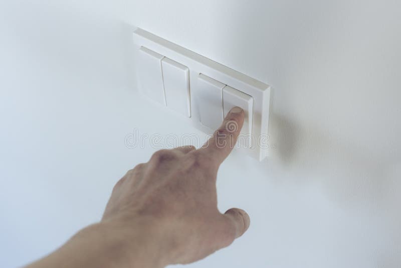 Hand Presses a Light Switch with a Finger Stock Photo - Image of power ...