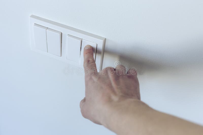 Hand Presses a Light Switch with a Finger Stock Image - Image of light ...