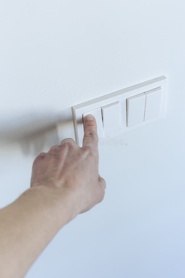 Hand Presses a Light Switch with a Finger Stock Photo - Image of power ...