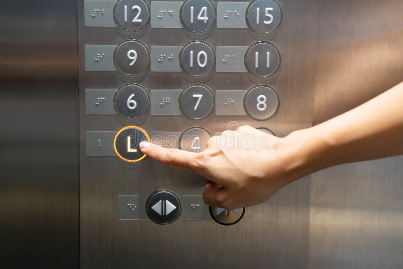 The Hand Presses on the Lobby Floor Elevator Button in Hotel Stock ...