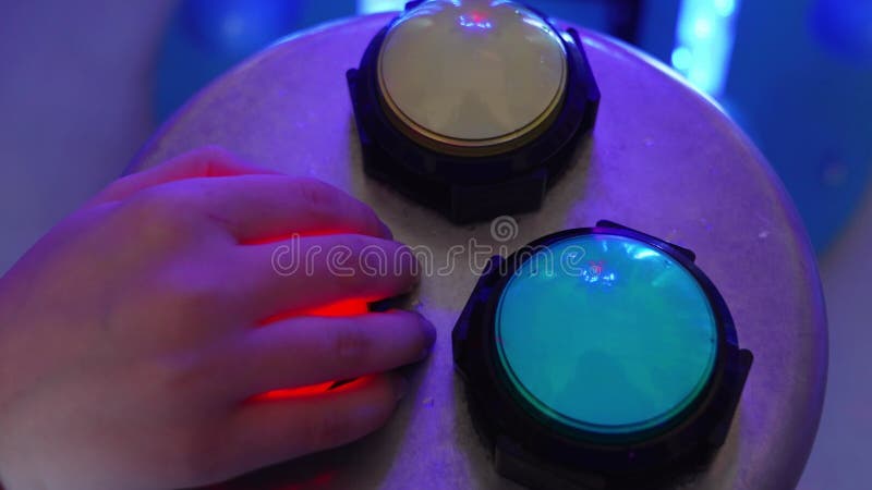 The Hand Presses the Multi-colored Glowing Buttons of the Light Bulb ...