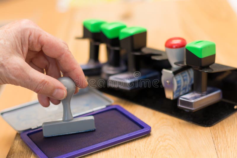 Hand Presses Stamp in Stamp Pad - Closeup Stock Image - Image of ...