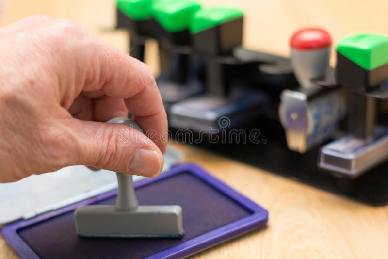 Hand Presses Stamp in Stamp Pad - Closeup Stock Photo - Image of rubber ...