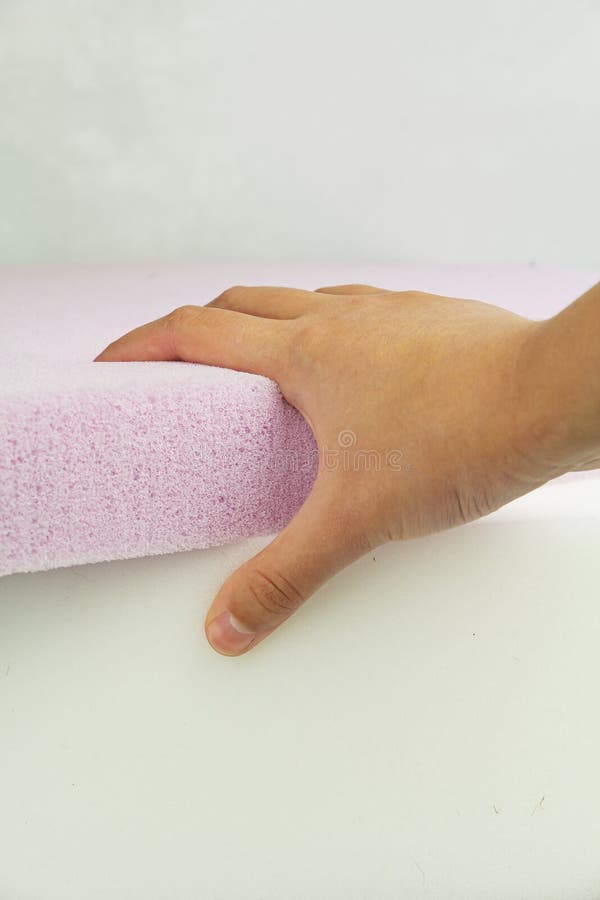 The Hand Presses on the Surface of the Rubber Foam. Checking Hardness ...