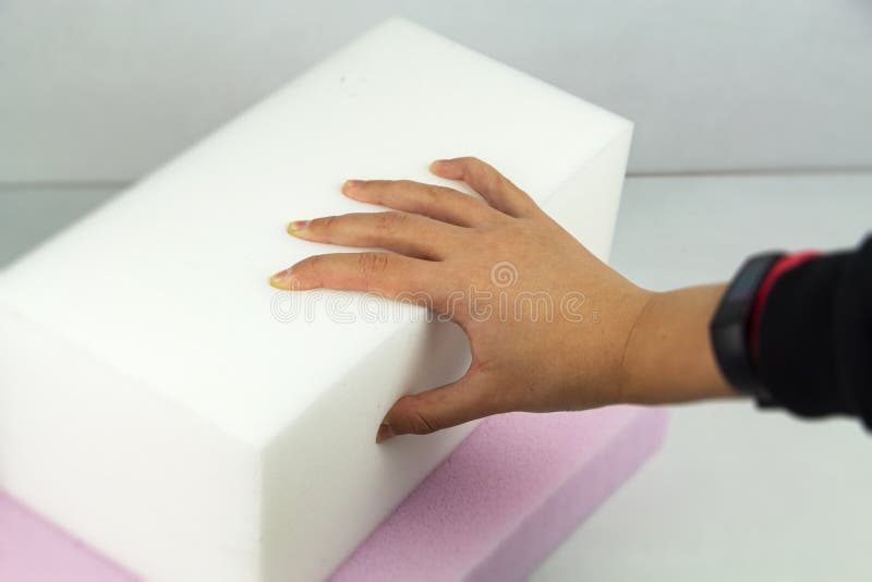 The Hand Presses on the Surface of the Rubber Foam. Checking Hardness ...