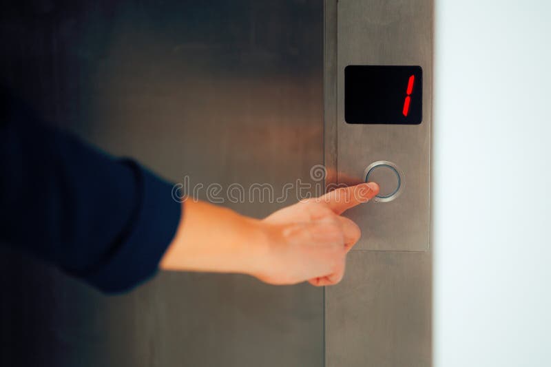 Hand Pressing a Button Calling the Elevator on First Floor Stock Image ...